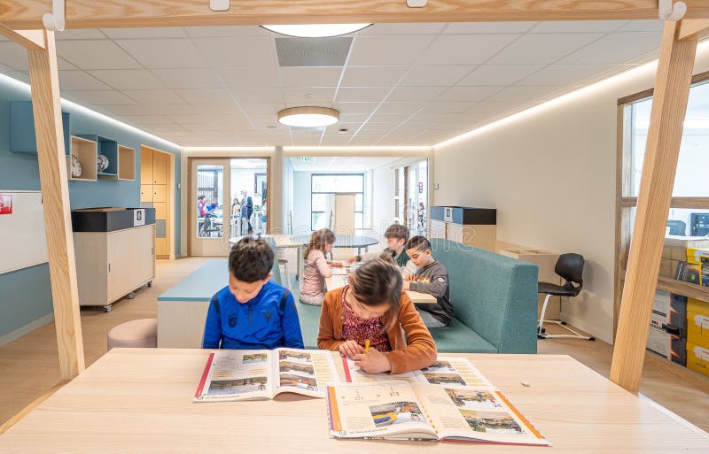 Children Engaged in Learning in a Modern Classroom. Stock Image - Image ...