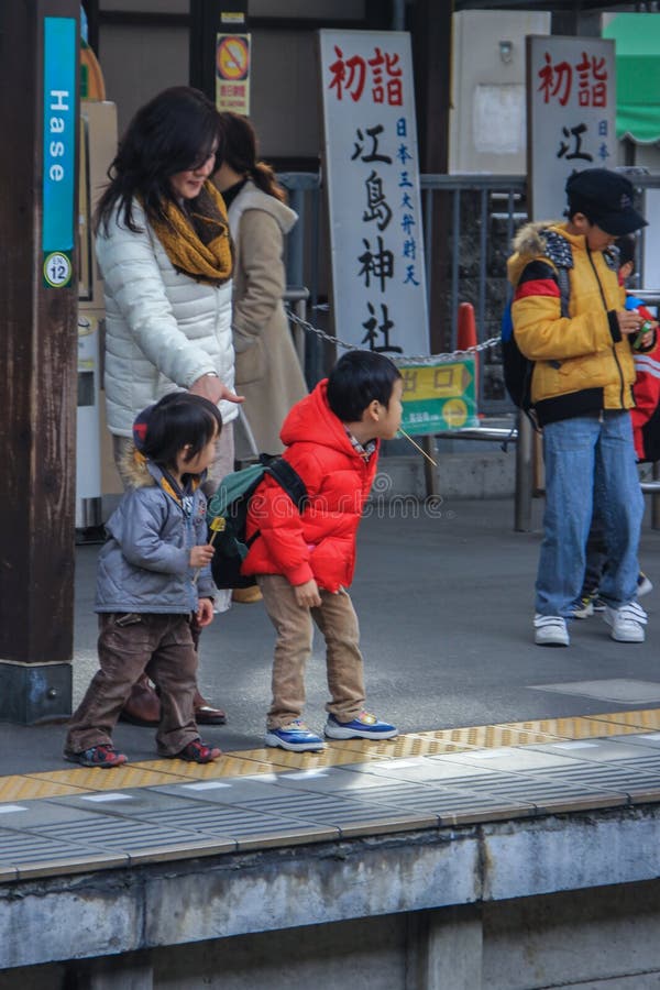 Children with Mom are on the Platform Waiting for the Train. Editorial ...