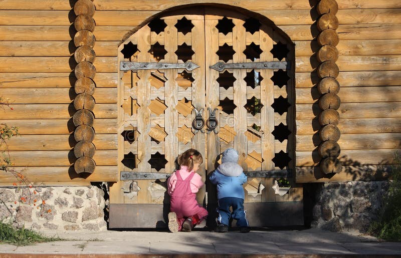 Children Near the Wooden Gates Stock Image - Image of peep, entrance ...