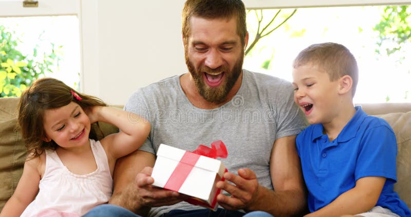 Children Offering a Gift To Their Father Stock Footage - Video of child ...