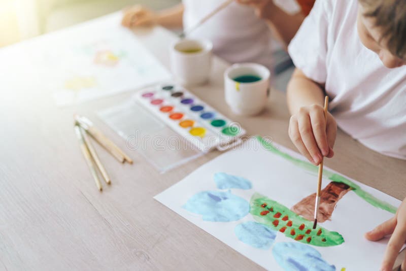 Children Paint Green Grass with a Tree and Blue Clouds Stock Image ...