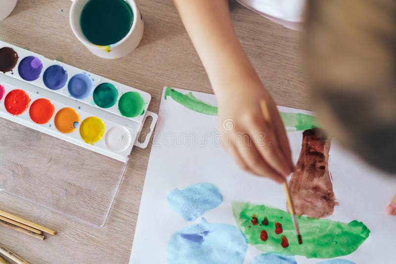 Children Paint Green Grass with a Tree and Blue Clouds Stock Image ...