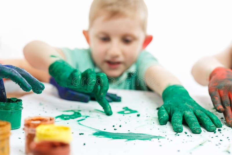 Children Paint with Hands on the Table Stock Photo - Image of ...