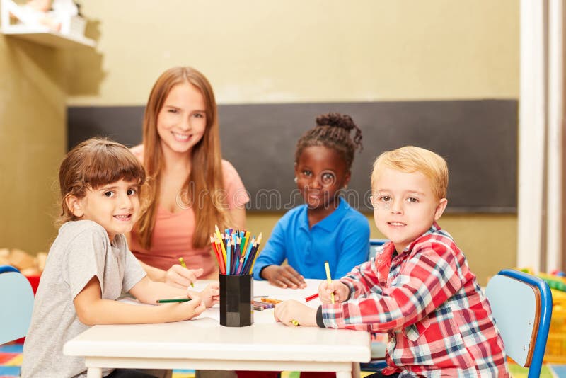 Children Paint in Multicultural Kindergarten Stock Photo - Image of ...