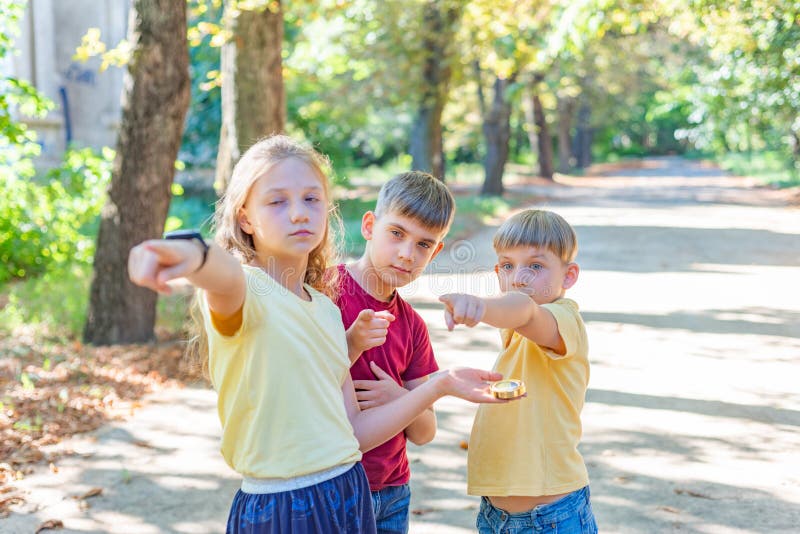 Children in the Park are Looking for Compass Directions Stock Photo ...