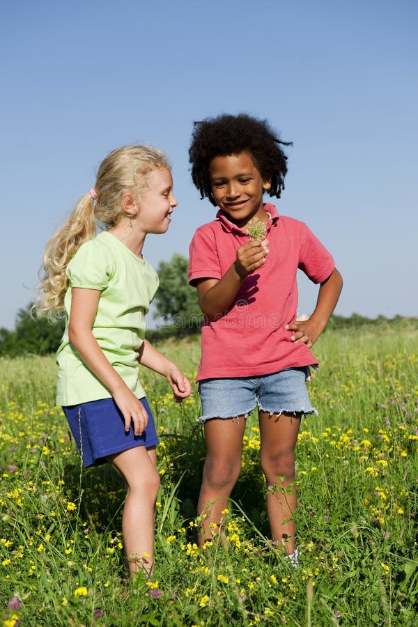 Children Picking Flowers Up Stock Image - Image of flower, giving: 15352105