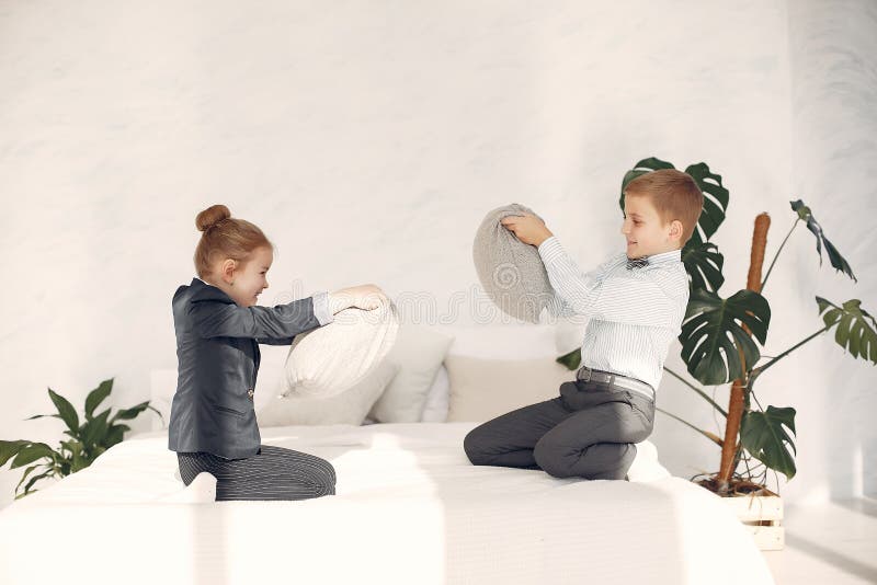 Children at Home Fight Pillows Stock Photo - Image of family, caucasian ...