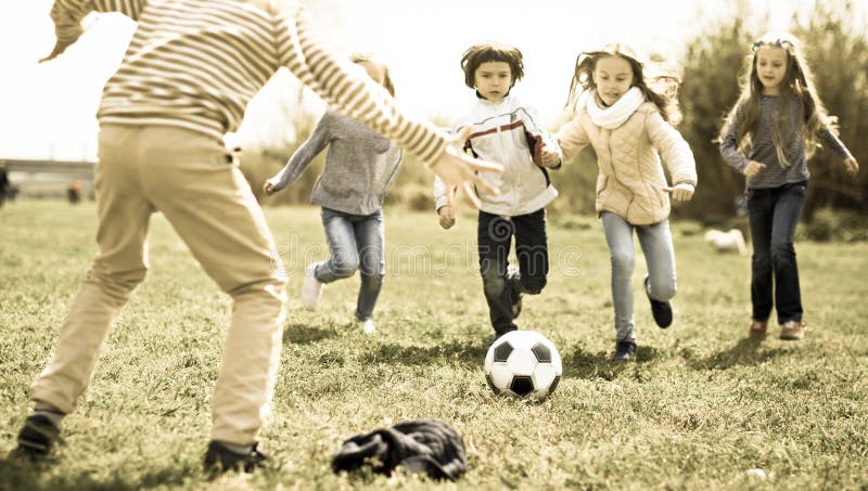 Children Play with Ball Outdoors in Spring Stock Image - Image of ...