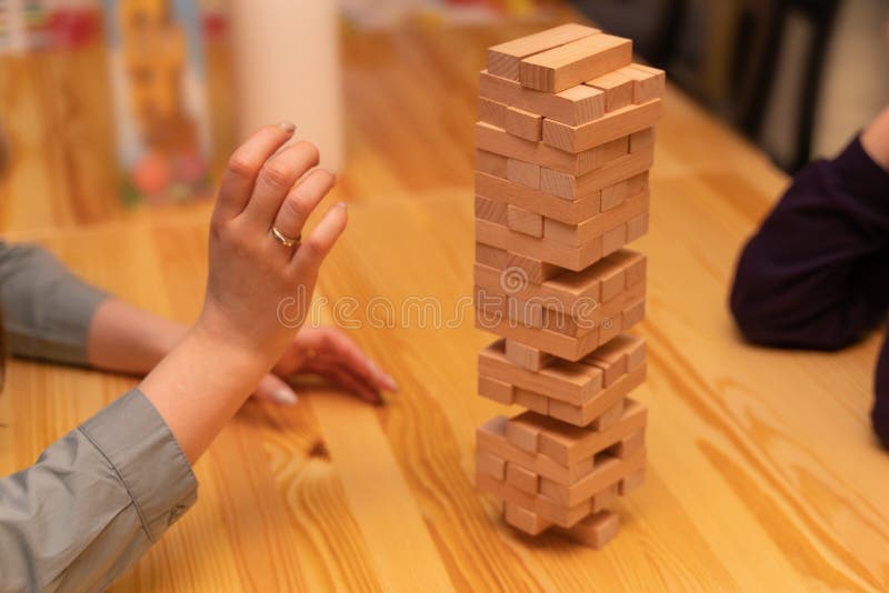 Children Play a Board Game, a Wooden Tower Stock Photo - Image of ...
