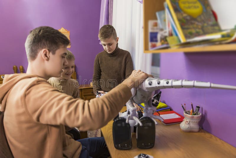 Kids playing with robots stock photo. Image of child - 245336240