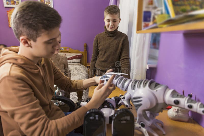 Kids playing with robots stock photo. Image of technology - 246049838