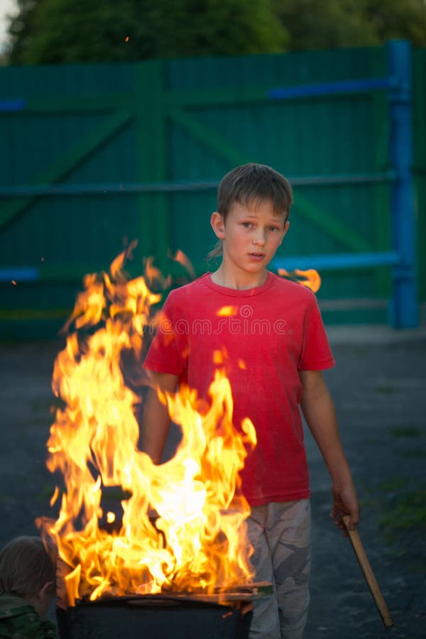 Children Play With Fire In The Grill Stock Photo - Image of daughter ...