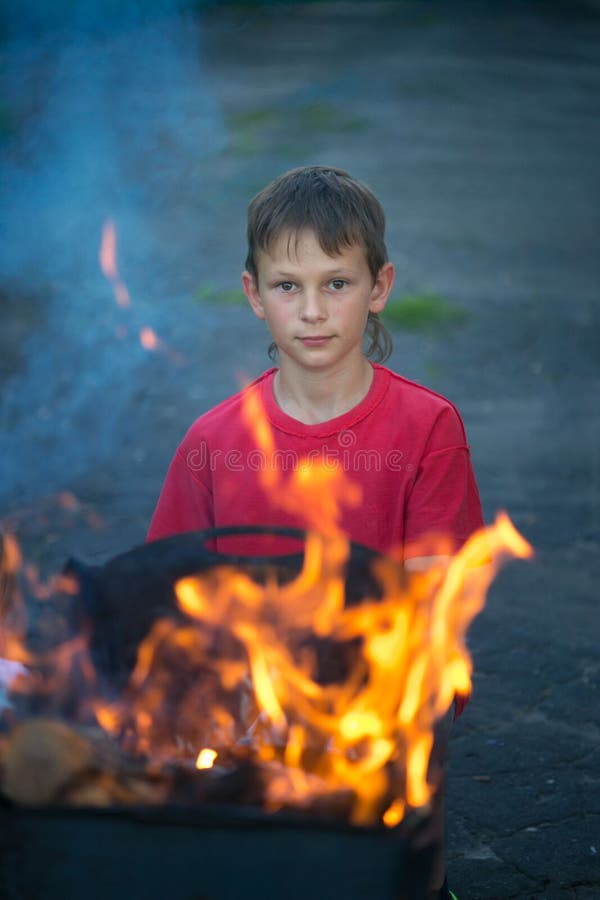 Children Play with Fire in the Grill Stock Image - Image of barbecue ...