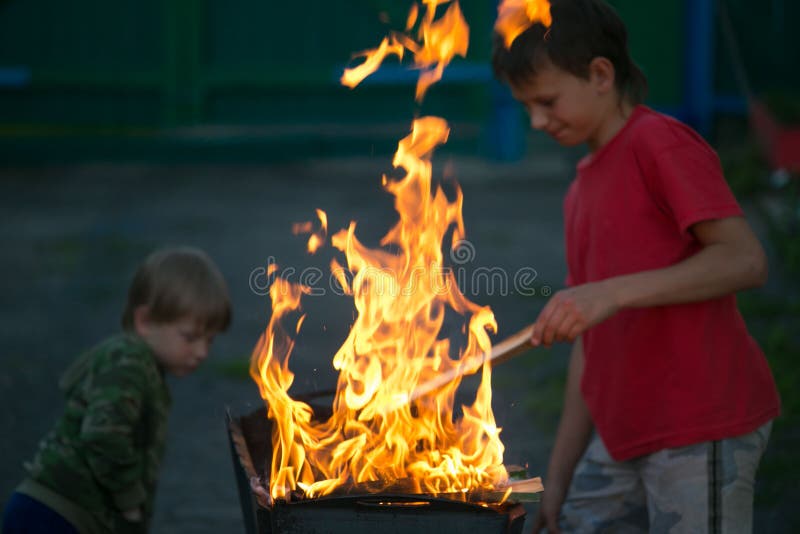 Children Play with Fire in the Grill Stock Image - Image of fire ...