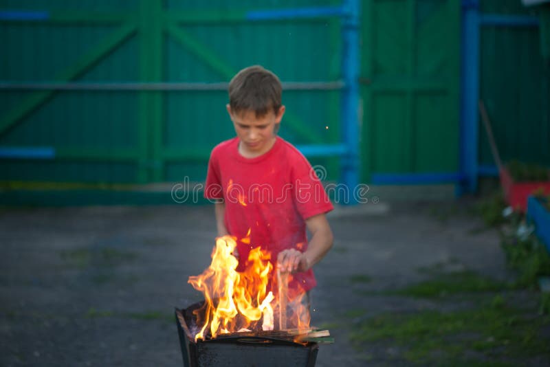 Children Play with Fire in the Grill Stock Image - Image of barbeque ...