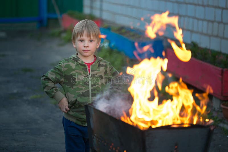 Children Play with Fire in the Grill Stock Image - Image of dinner ...