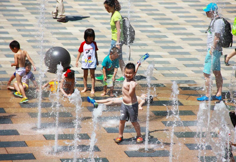 Girl Enjoys Water Fountain editorial stock photo. Image of happy - 74646273