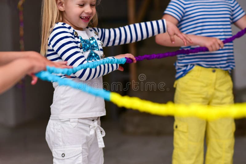 Children Play a Game Pull the Ribbon at the Party Stock Photo - Image ...
