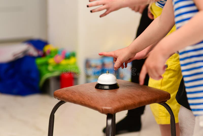 Children Play a Game Who Will Press the Bell Faster Stock Image - Image ...
