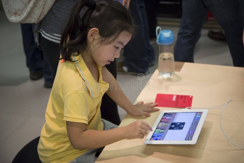 Children play ipad editorial photo. Image of asia, macintosh - 27591541