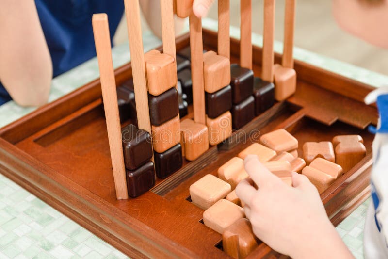 Dad and Kid Play Logic Game. Father and Son Playing Chess on Grass ...