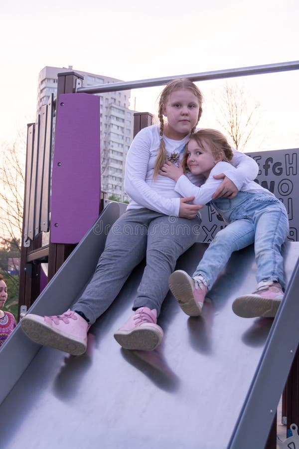 Children Play on a Modern, Secure Playground Stock Image - Image of ...