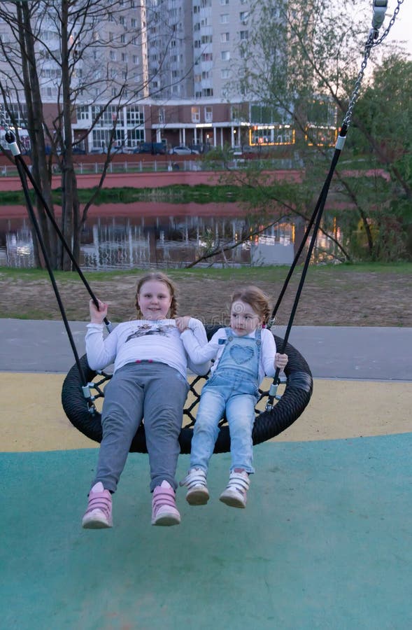 Children Play on a Modern, Secure Playground Stock Image - Image of ...