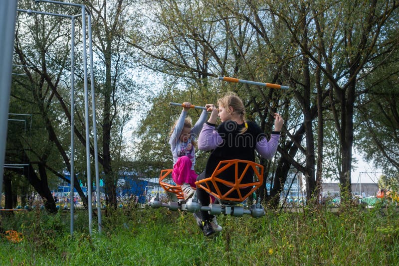 Children Play on a Modern, Secure Playground Stock Photo - Image of ...