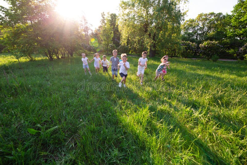Children Play Outdoors Running and Having Fun Stock Photo - Image of ...