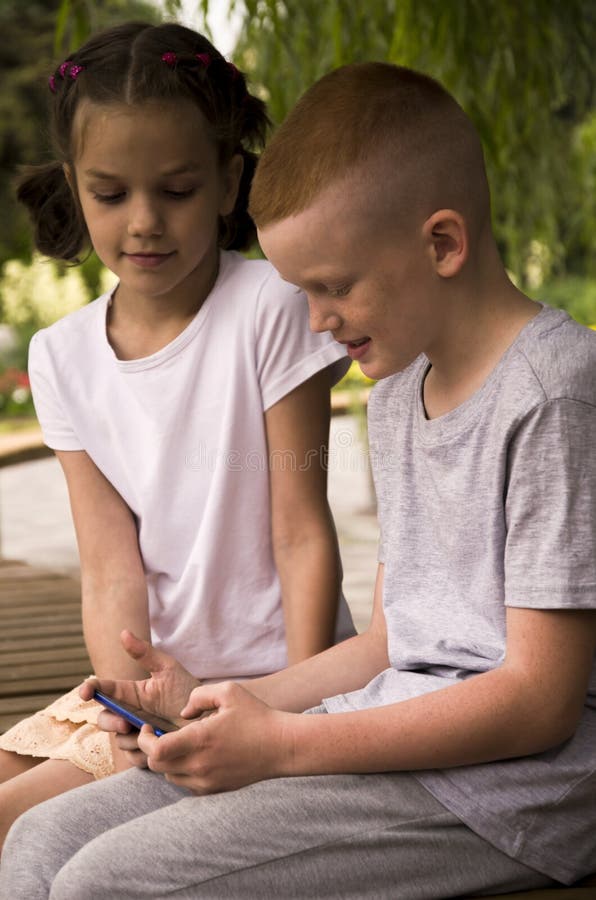 Children Play on the Phone while Walking Stock Image - Image of game ...