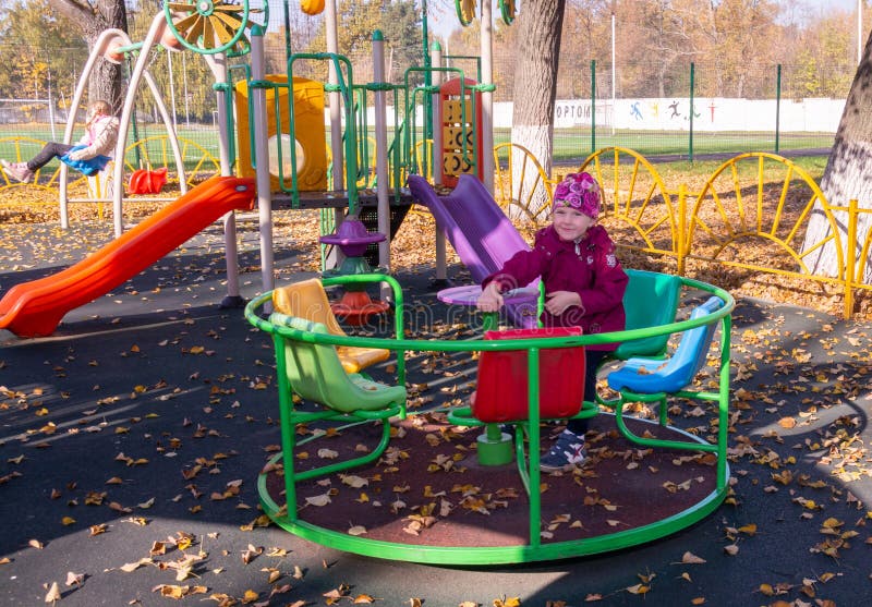 Children Play on the Playground on a Beautiful Autumn Day. Stock Photo ...