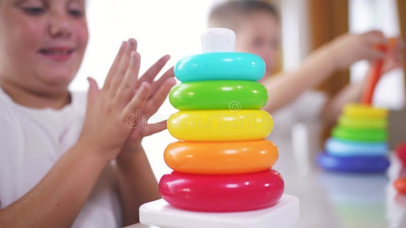Children Play in Pyramid in Kindergarten. Learning Toy Development ...