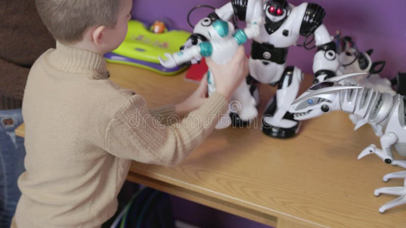 Kids playing with robots stock video. Video of child - 243938095