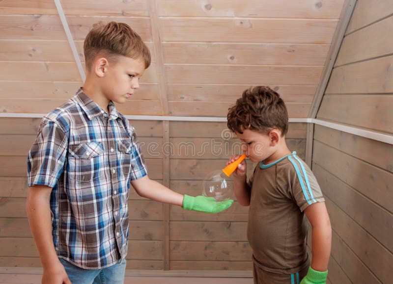 Children Play with Soap Bubbles Stock Image - Image of palm, soap ...
