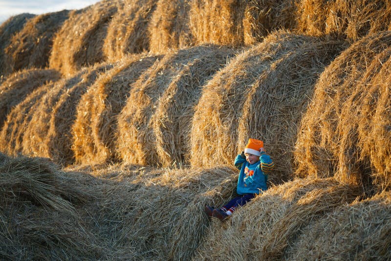 Mom and Son Play with a Straw Drip in Nature. Stock Image - Image of ...