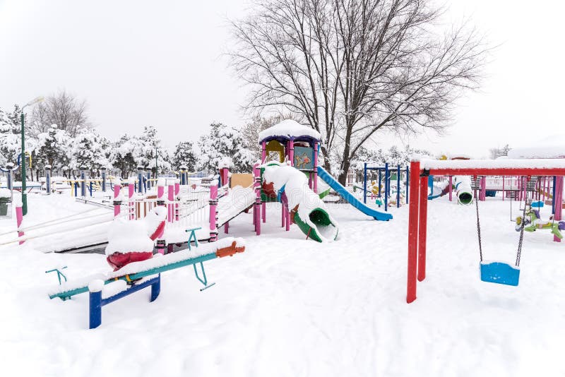 Children Playground in Winter Snow Stock Photo - Image of colorful ...