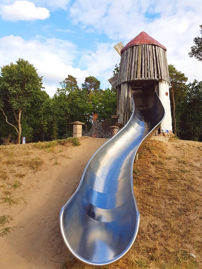 Children Playground with Wooden Windmill in Slide Stock Photo - Image ...