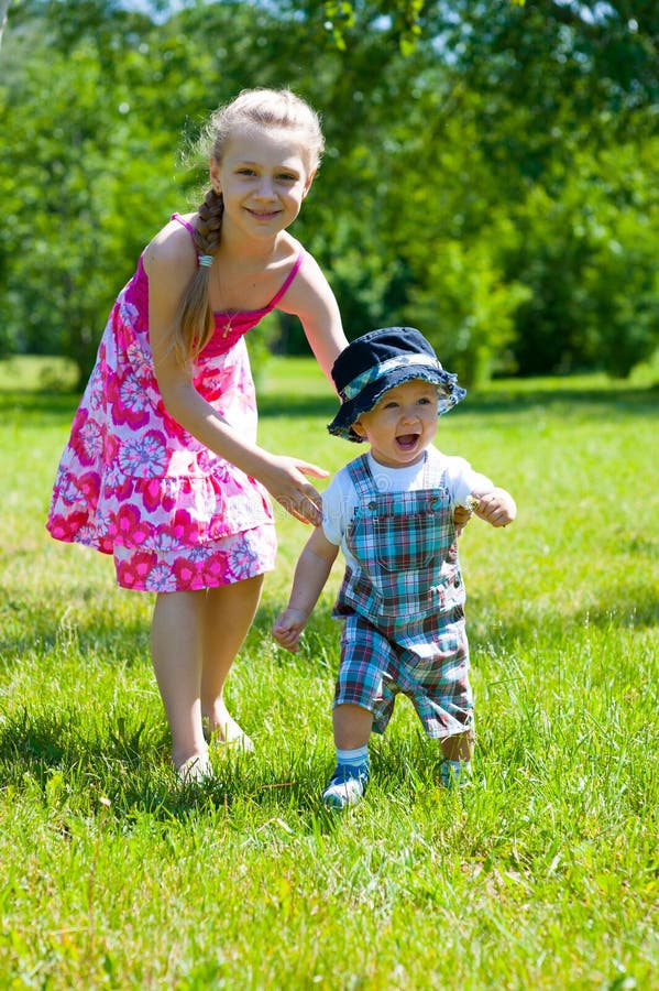 Two Young Children Running on Path Smiling Stock Image - Image of ...