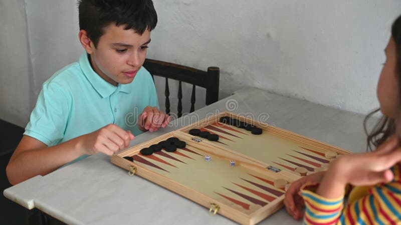 Children Playing Backgammon with Focus and Concentration Stock Video ...