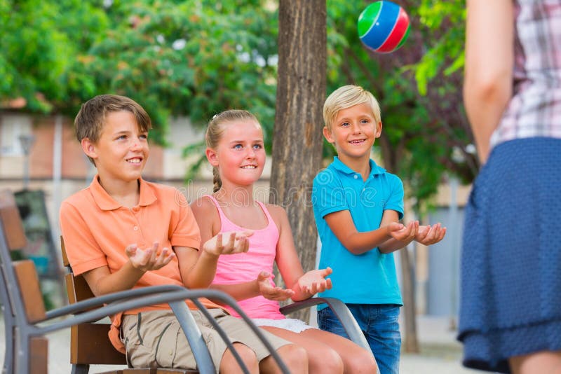 Children are playing ball stock image. Image of childhood - 233827775