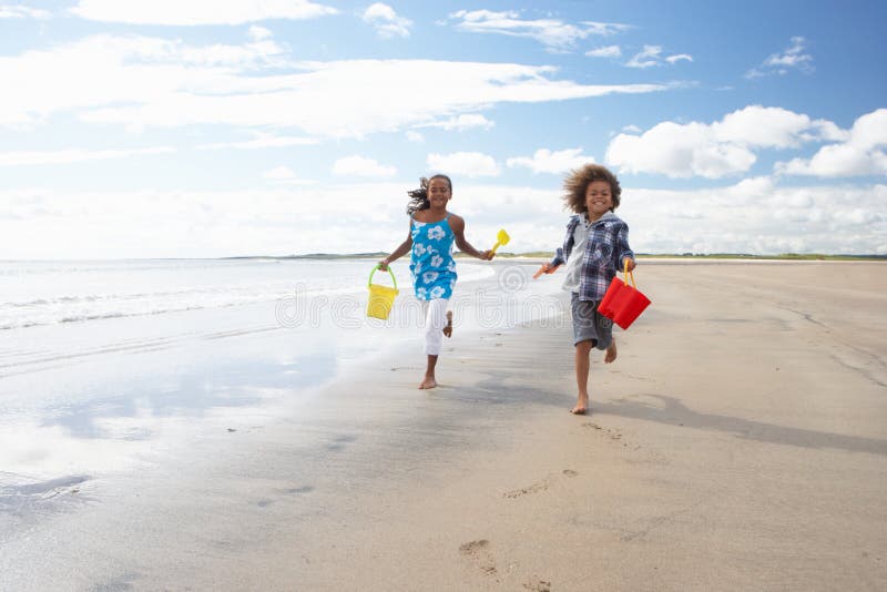 Children playing on beach stock photo. Image of vacation - 19683586