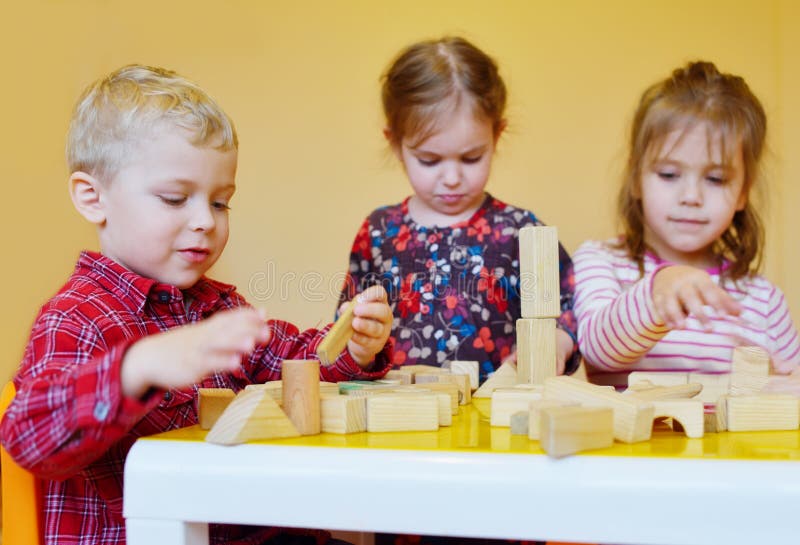 Children playing blocks stock image. Image of block, development - 66559943