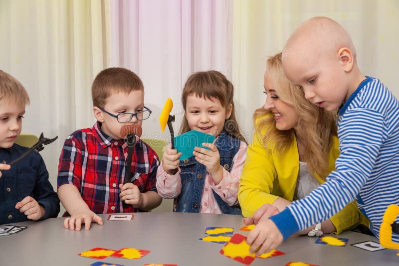 Children hugging teacher stock image. Image of mentor - 112965451