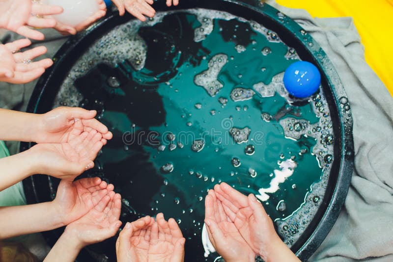 Children Playing with Bubbles Outdoor, Selective Focus Many Hands, Top ...