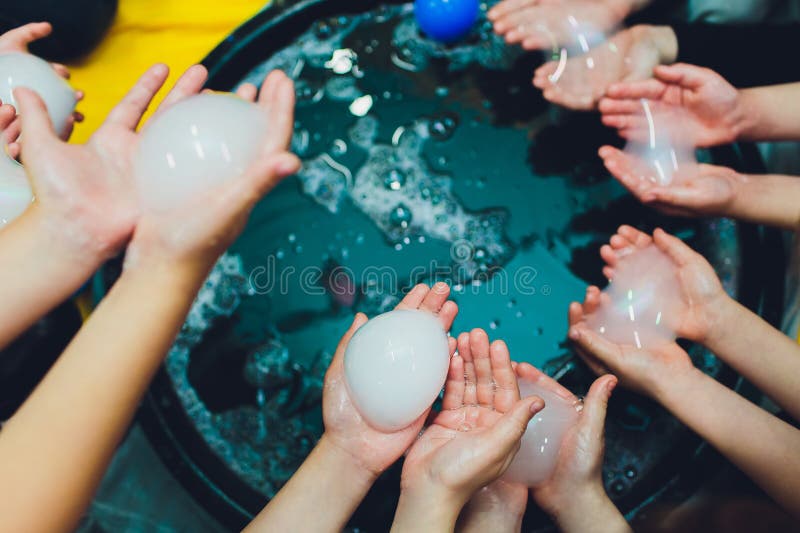 Children Playing with Bubbles Outdoor, Selective Focus Many Hands, Top ...