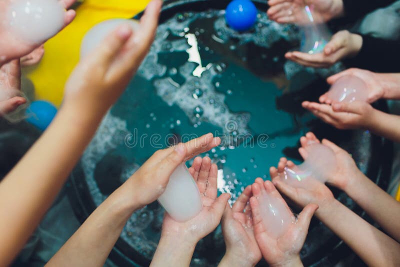 Children Playing with Bubbles Outdoor, Selective Focus Many Hands, Top ...