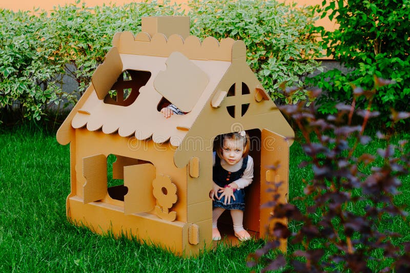 Children are Playing in Cardboard Kid House. Child Having Fun Outdoors ...
