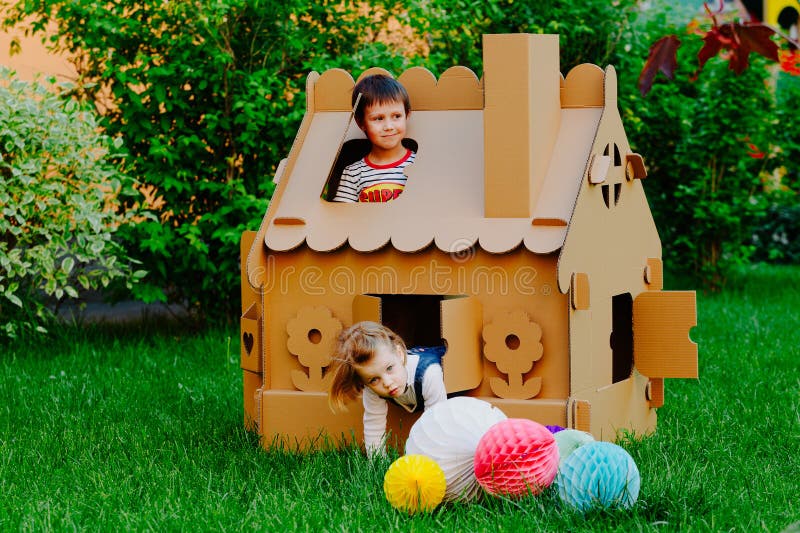 Children are Playing in Cardboard Kid House. Child Having Fun Outdoors ...