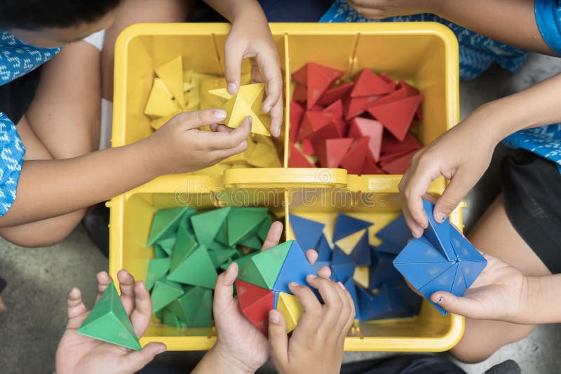Children Playing with Colorful Geometric Plastic Shapes for Learning and Creativity in an ...