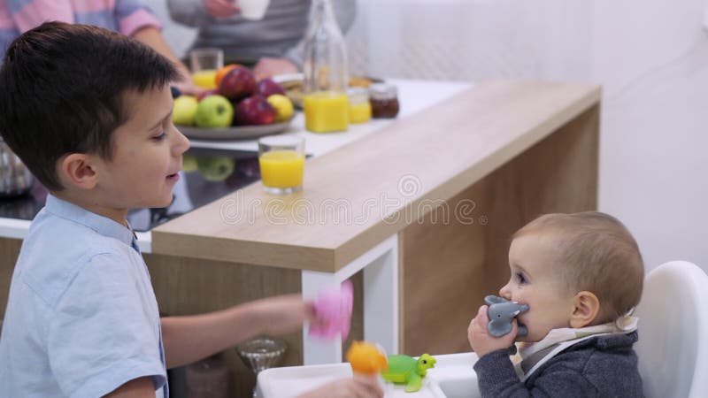 Children Playing beside Dining Table Stock Video - Video of childhood ...